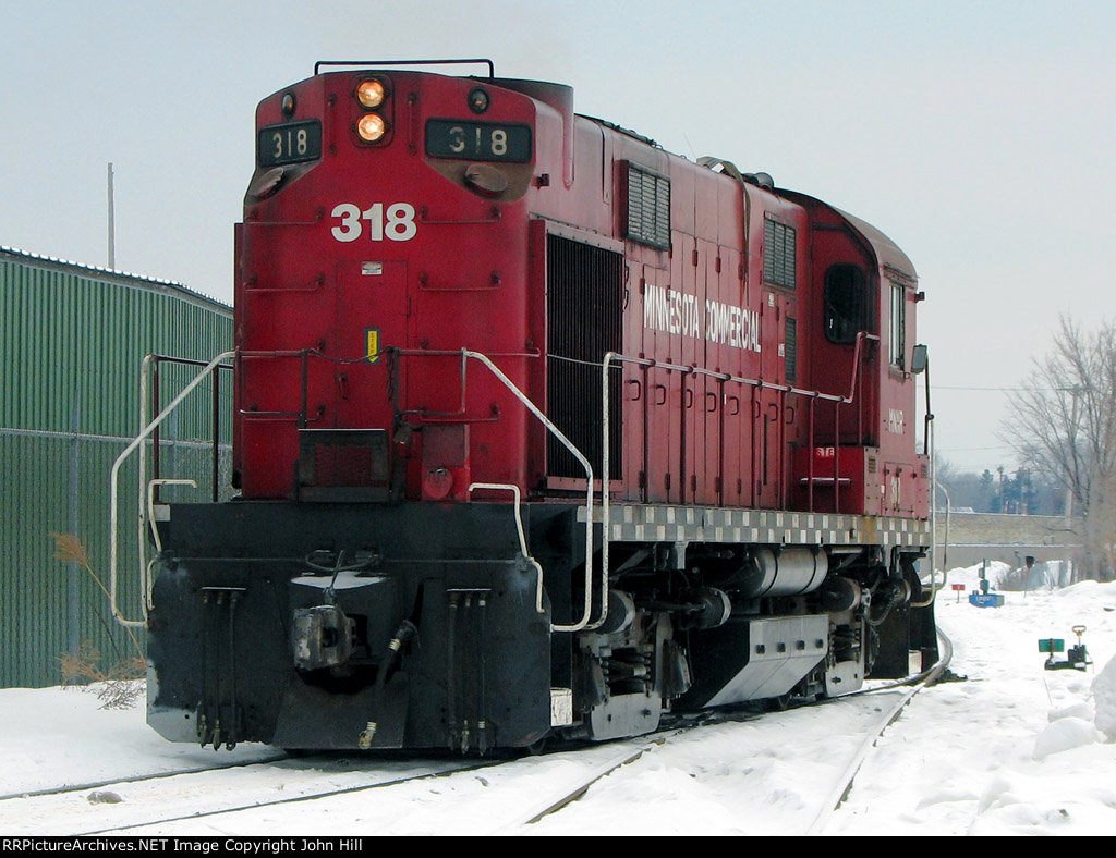110105019 MNNR 318 Rolls Past Amtrak Midway Station